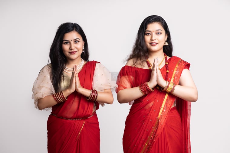 Two beautiful women in Red saree doing Namaste - Photos Nepal