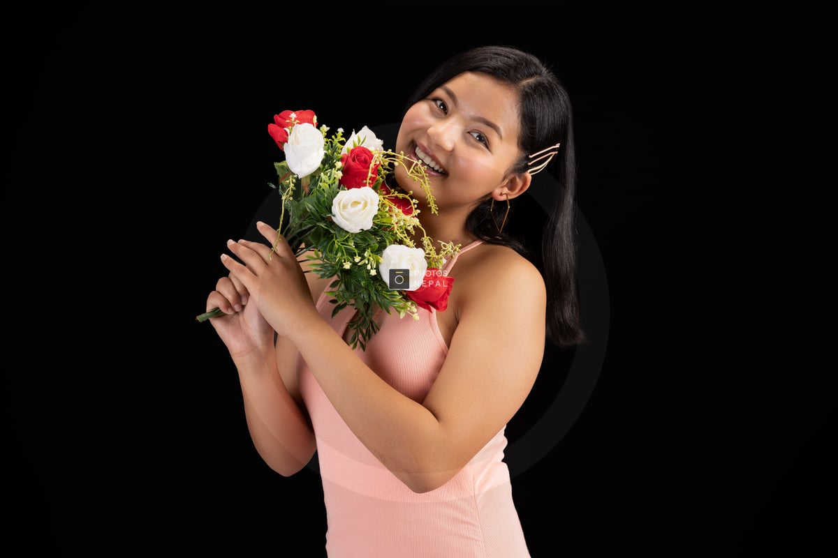 Cheerful Nepali Model In Pink Dress Holding Flowers Joyful Portrait cheerful-nepali-model-in-pink-dress-holding-flowers-joyful-portrait
