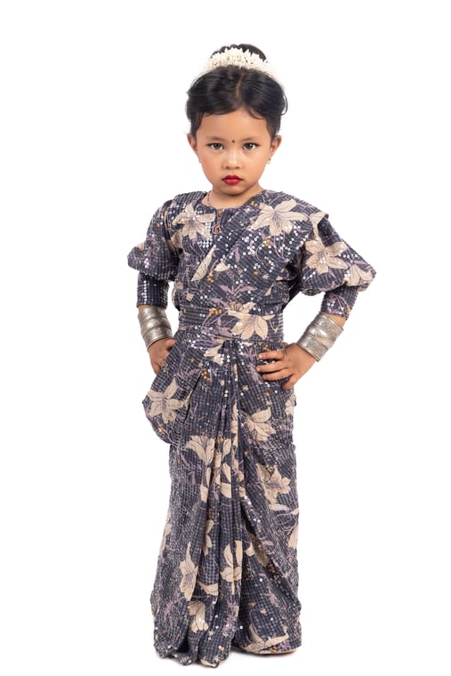 Serious baby Nepali girl in traditional sari with angry expression ...