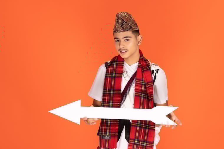 Magar Man in Traditional Dress with Right Arrow Sign Looking at Camera ...